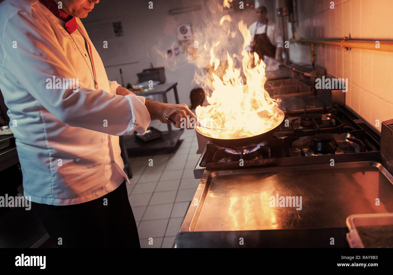 Chef working flaming pan hi-res stock photography and images - Alamy