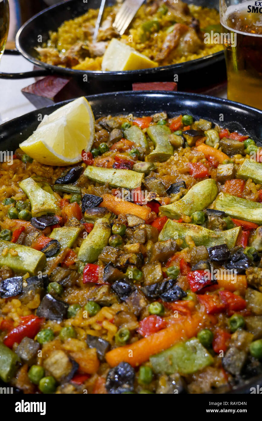 Paella plates on a restaurant table, Madrid, Spain Stock Photo - Alamy