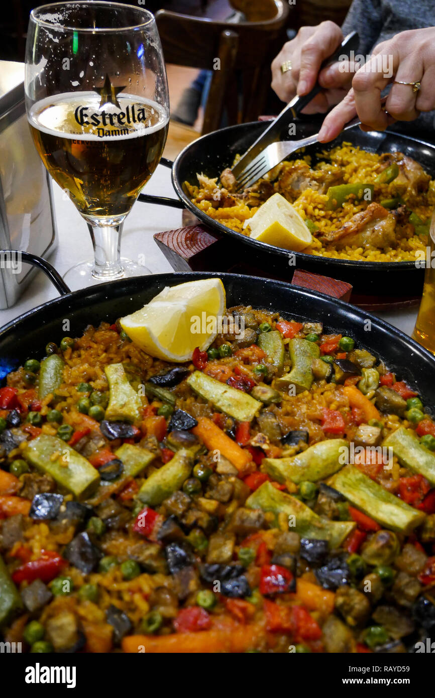 Paella plates on a restaurant table, Madrid, Spain Stock Photo - Alamy