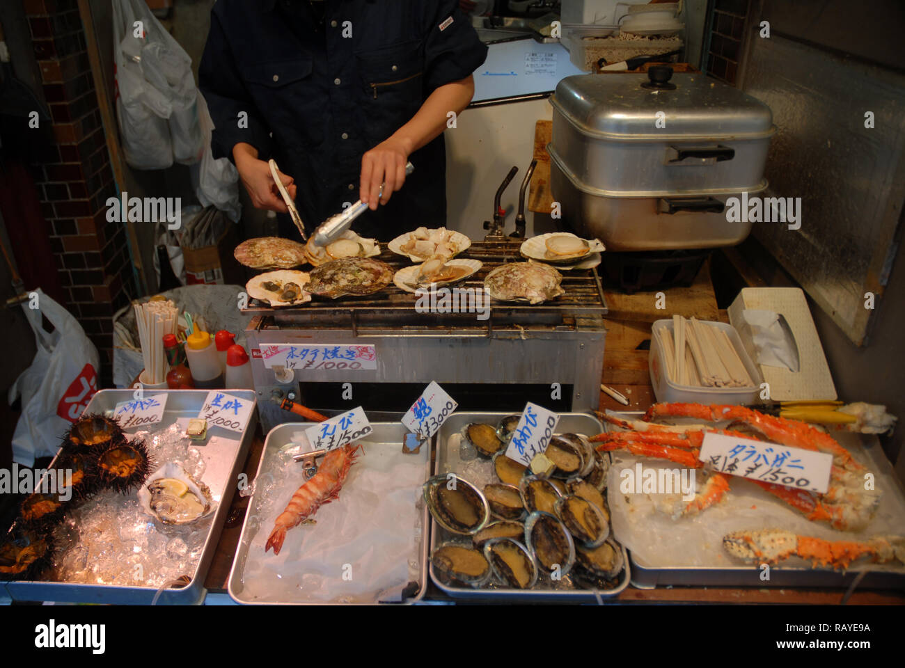 Fresh fish being cooked at Tsukiji Fish Market, Tokyo, Japan Stock ...