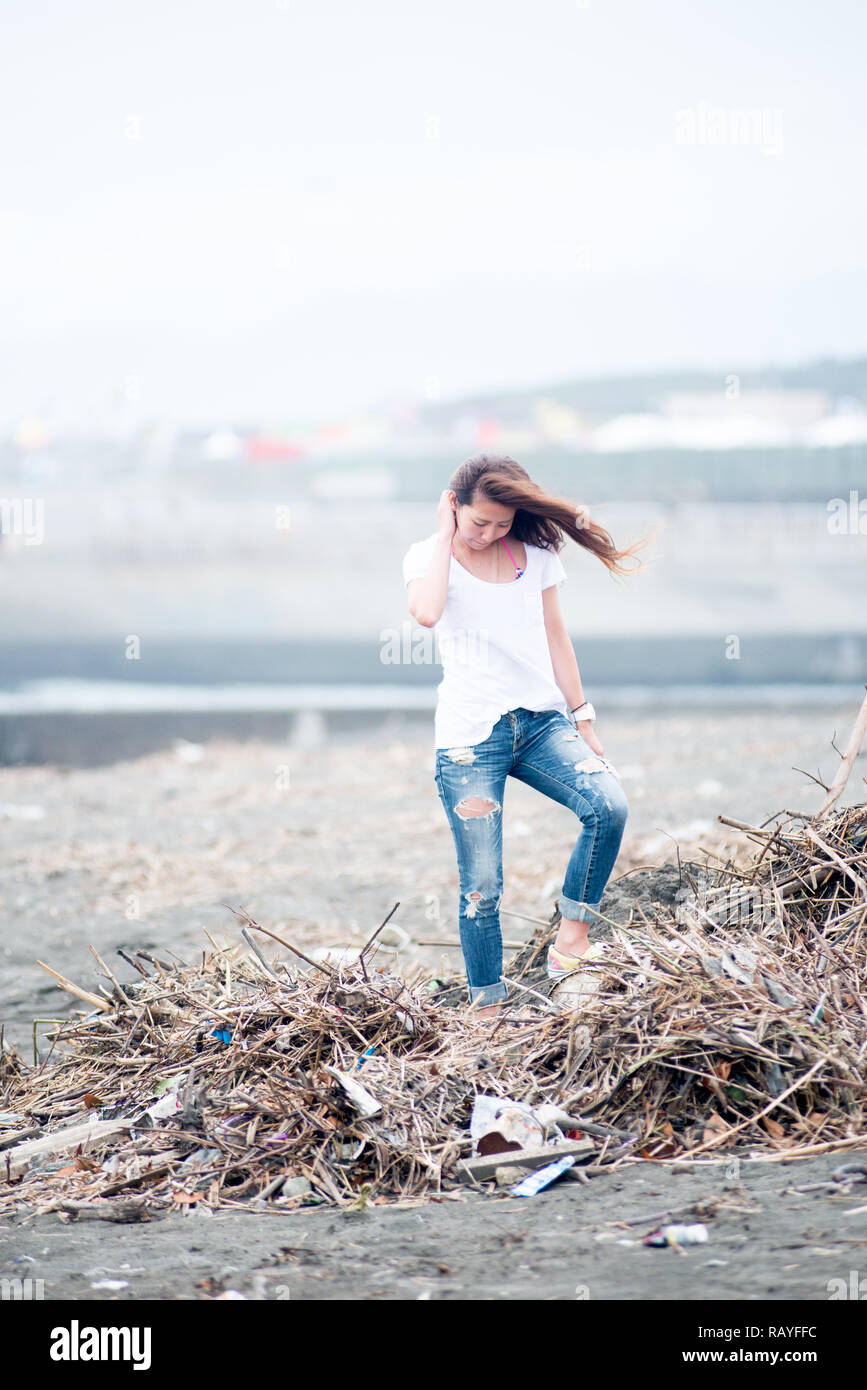Asian female model poses for pictures on the street Stock Photo - Alamy