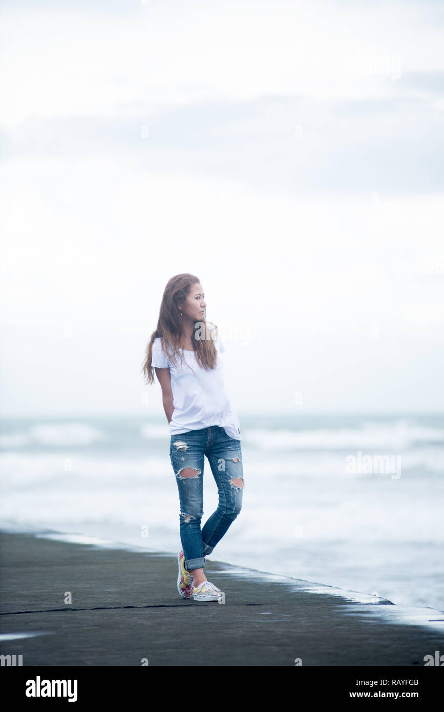 Asian female model poses for pictures on the street Stock Photo - Alamy