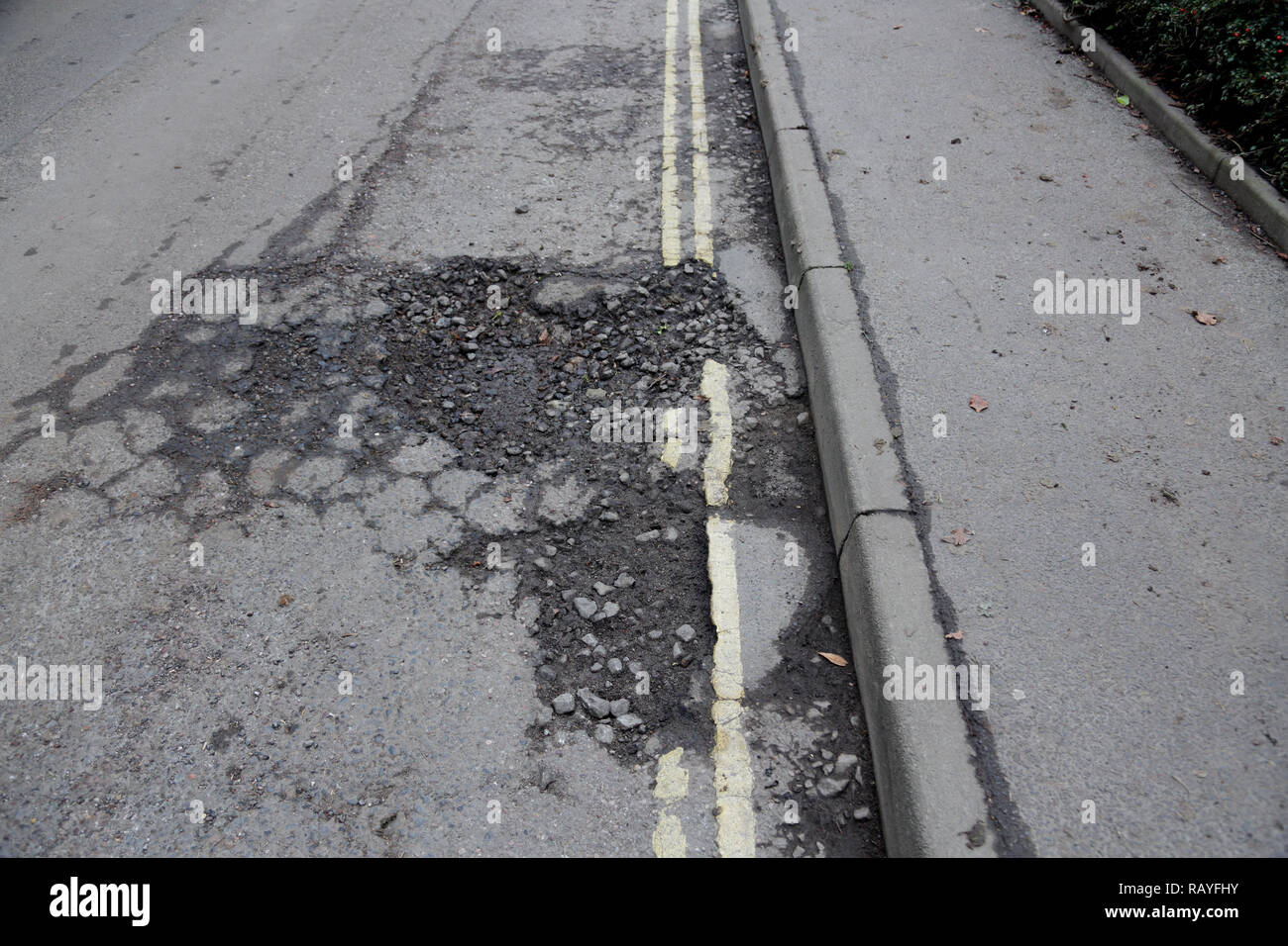 Potholes in British roads Stock Photo - Alamy