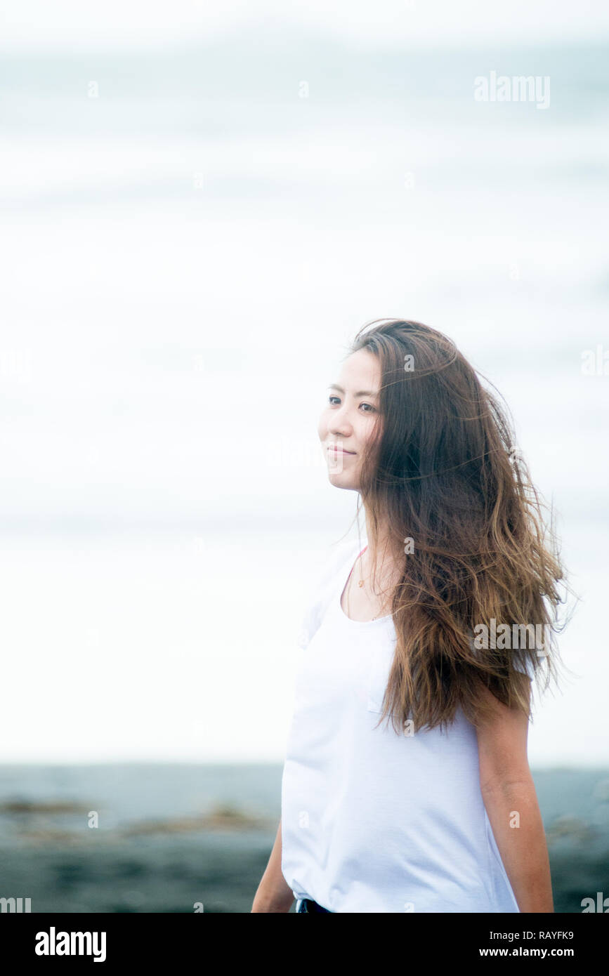 Asian female model poses for pictures on the street Stock Photo - Alamy