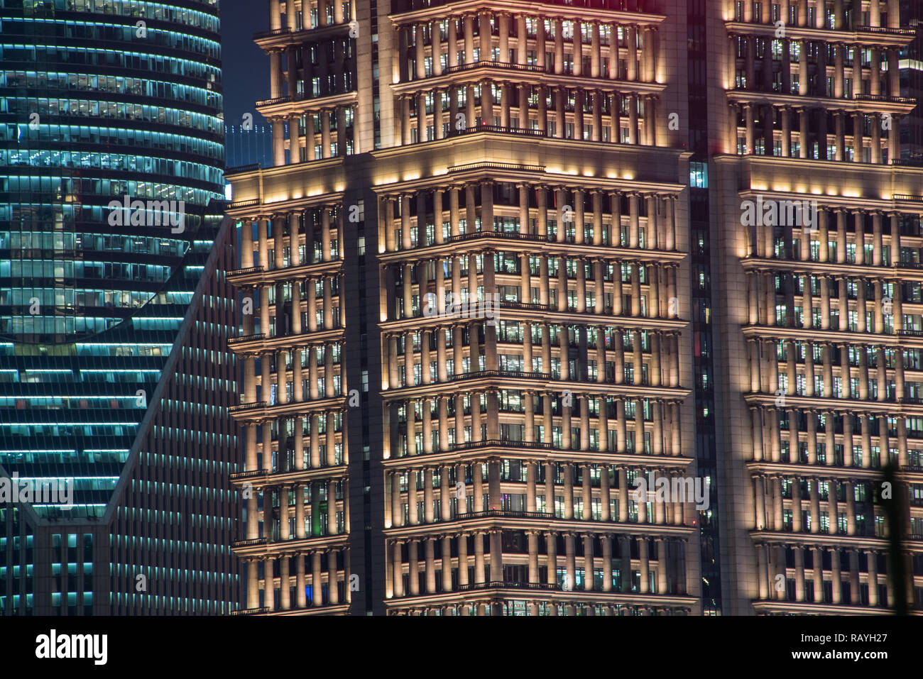 background of colored highrises with many illuminated windows Stock ...