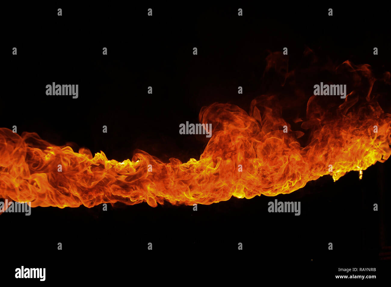 Blazing flames over black background Stock Photo - Alamy