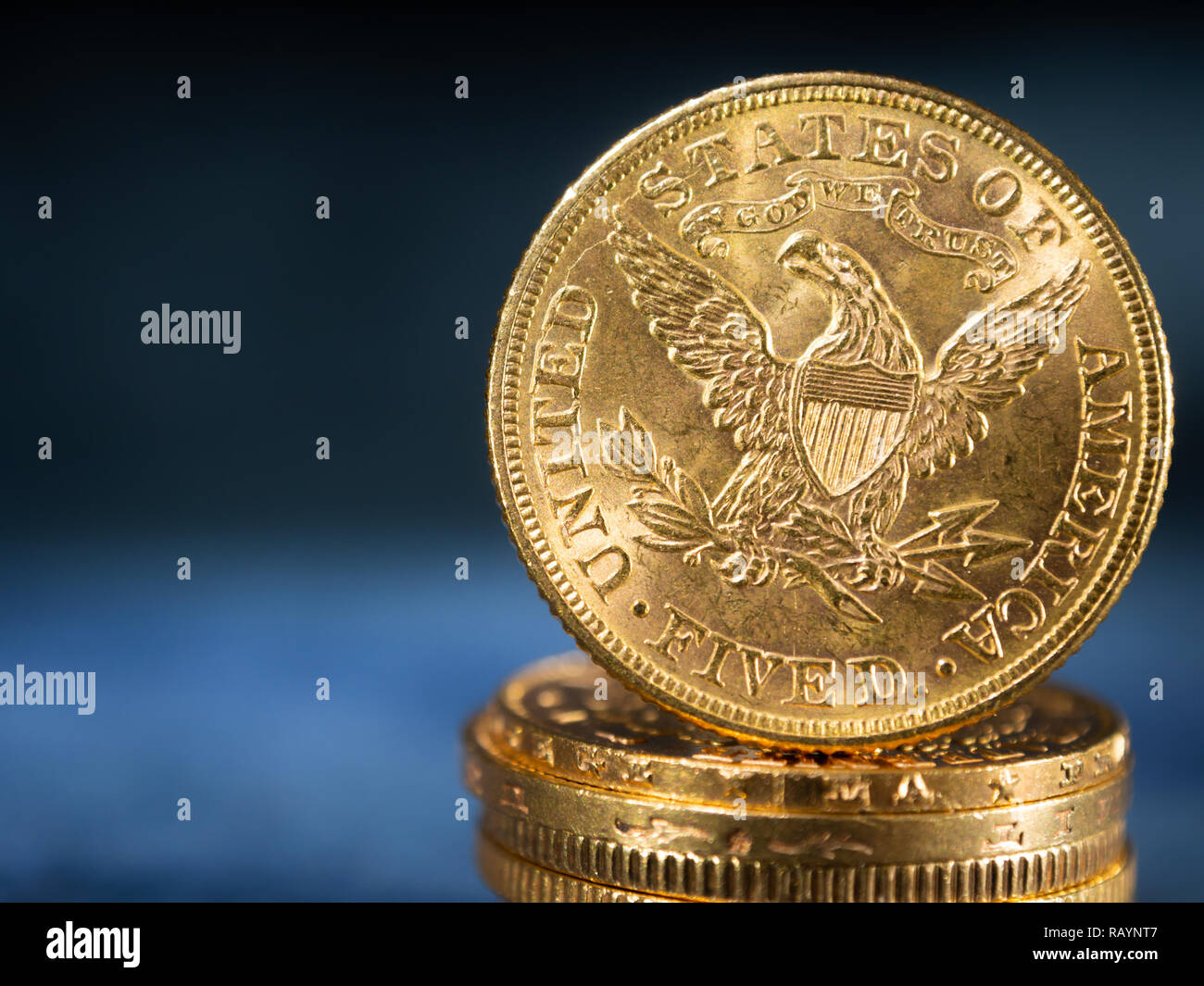 Real Gold coins over dark background Stock Photo - Alamy