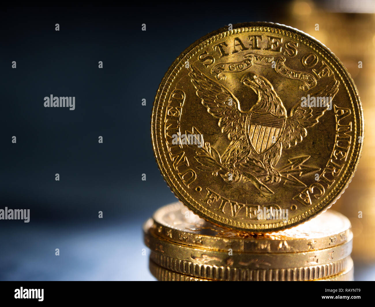 Real Gold coins over dark background Stock Photo - Alamy