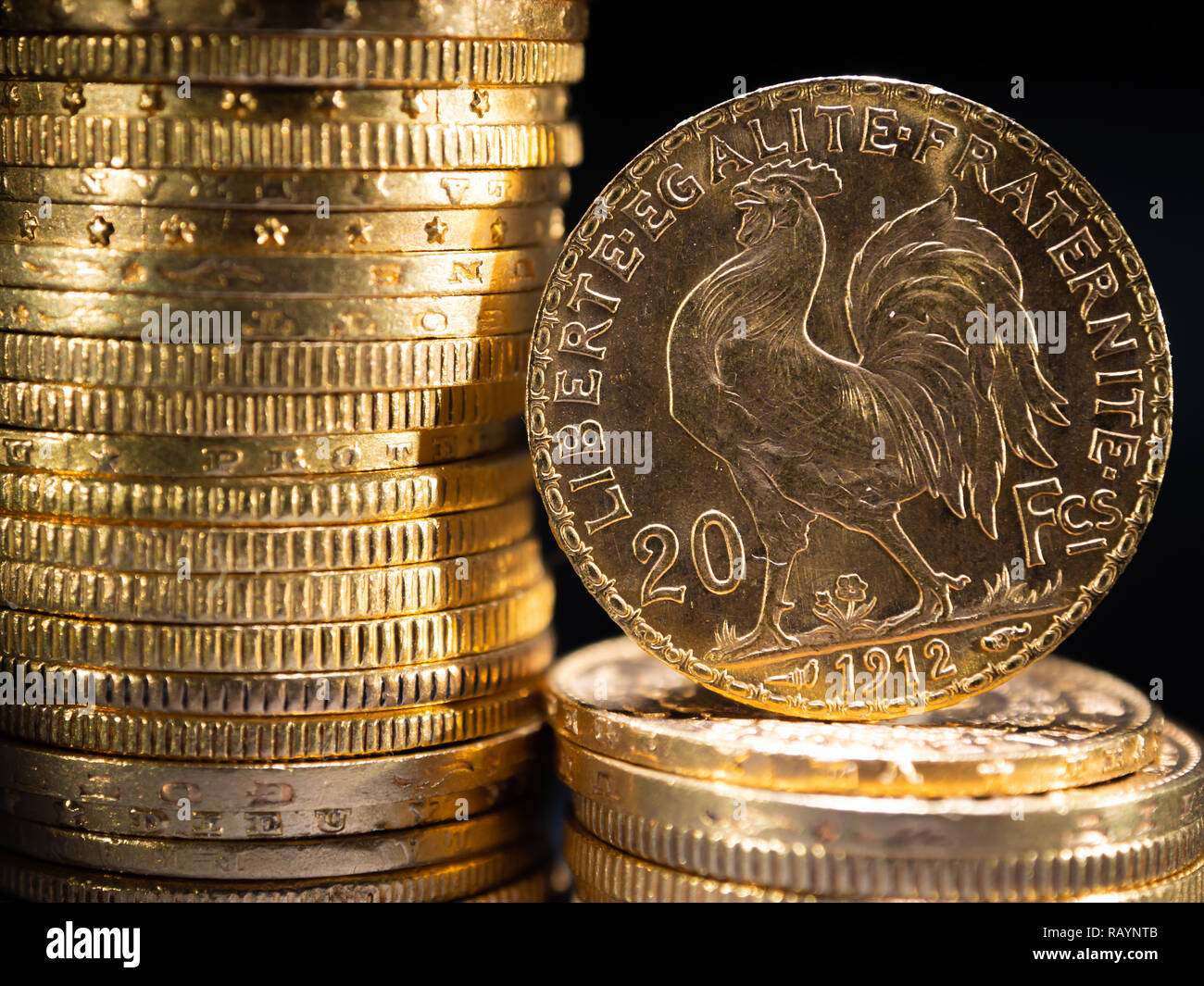 Real Gold coins over dark background Stock Photo - Alamy