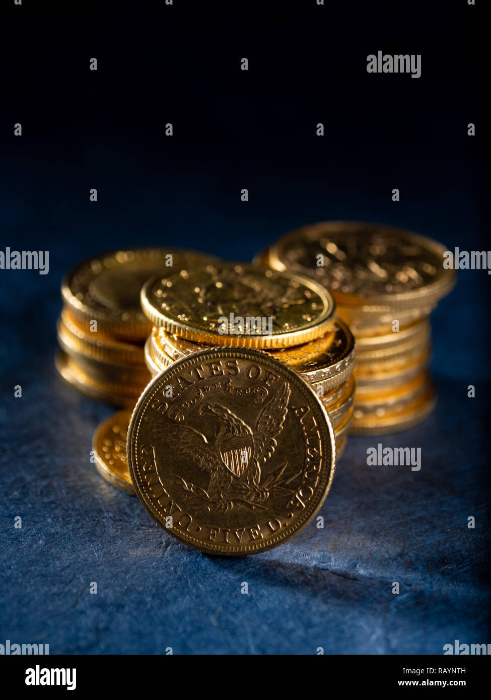 Real Gold coins over dark background Stock Photo - Alamy