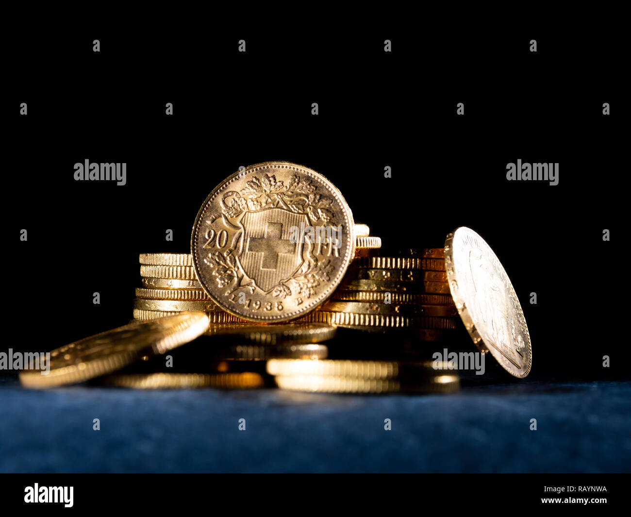 Real Gold coins over dark background Stock Photo - Alamy