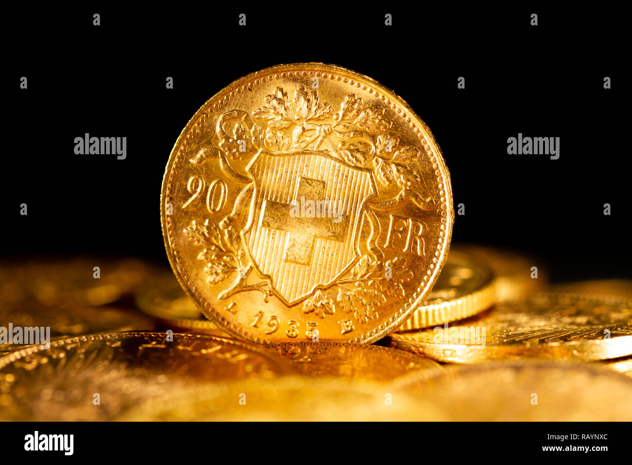 Real Gold coins over dark background Stock Photo - Alamy