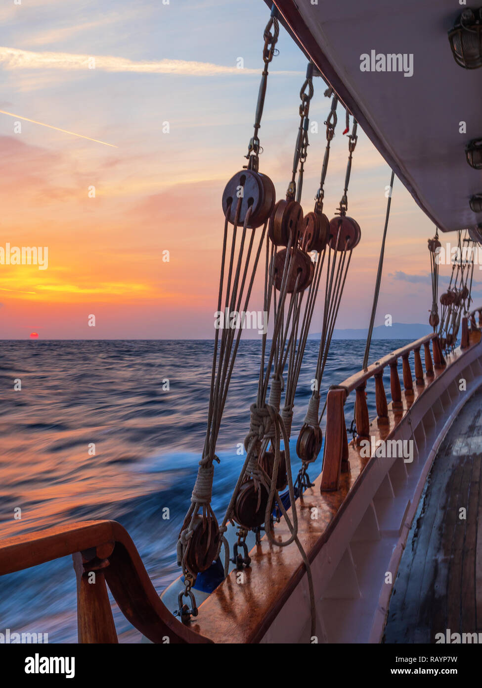 Sunset at the Sailboat deck while cruising in the Cyclades in Greece ...