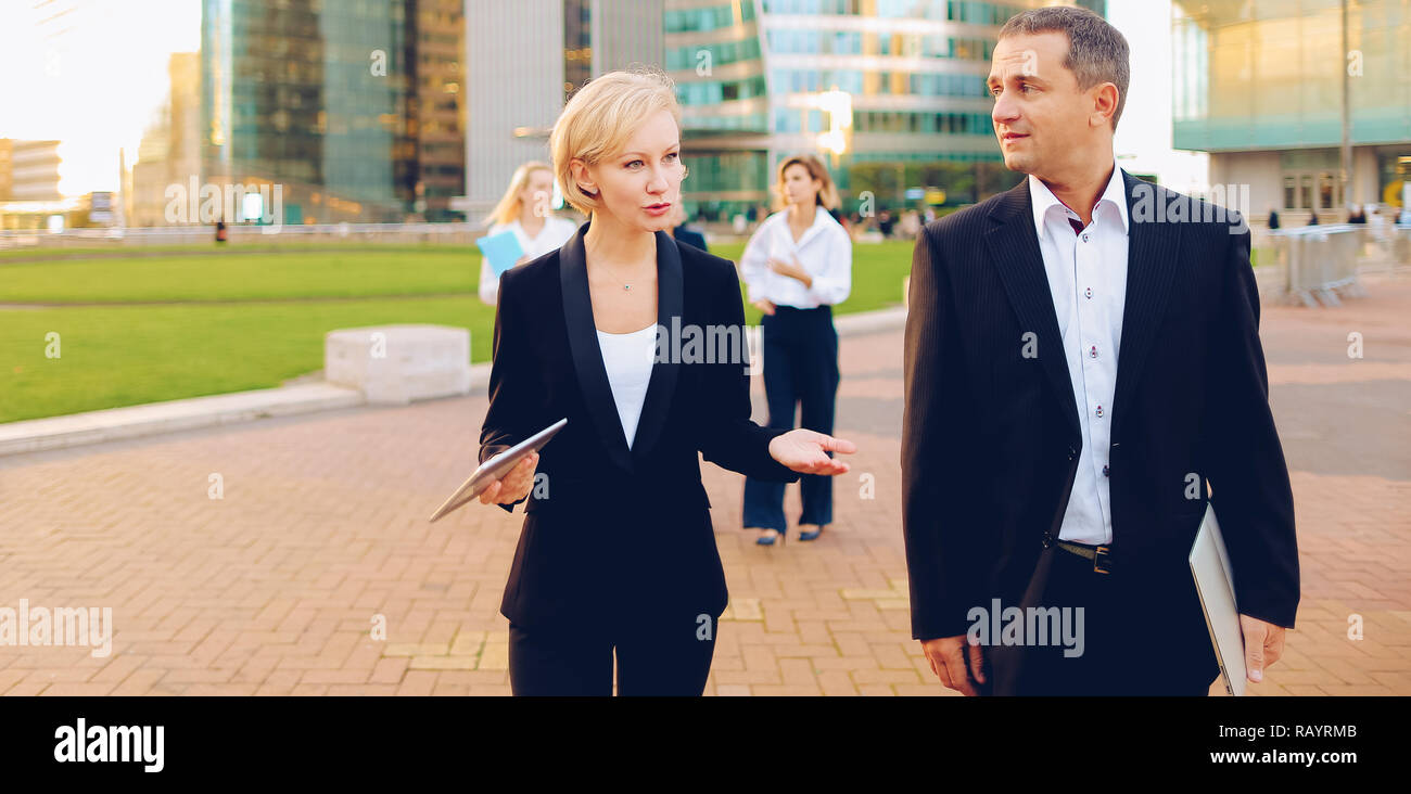 Colleagues walking after business conference in La Defense Paris Stock ...