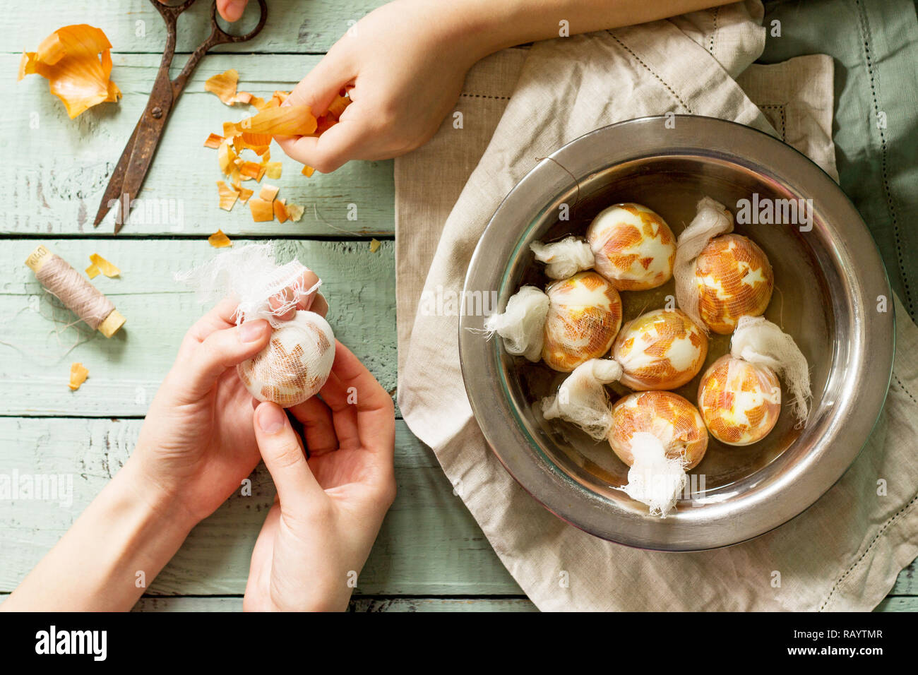 Preparation of Easter eggs for dying with onion peels: eggs with a ...