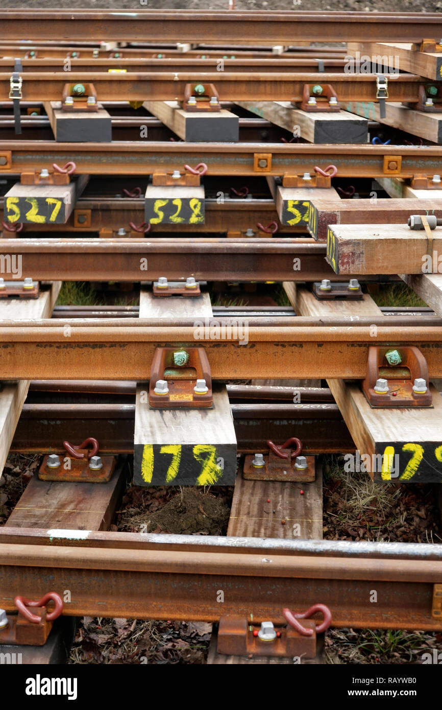 Sections of new rail track awaiting laying Stock Photo - Alamy