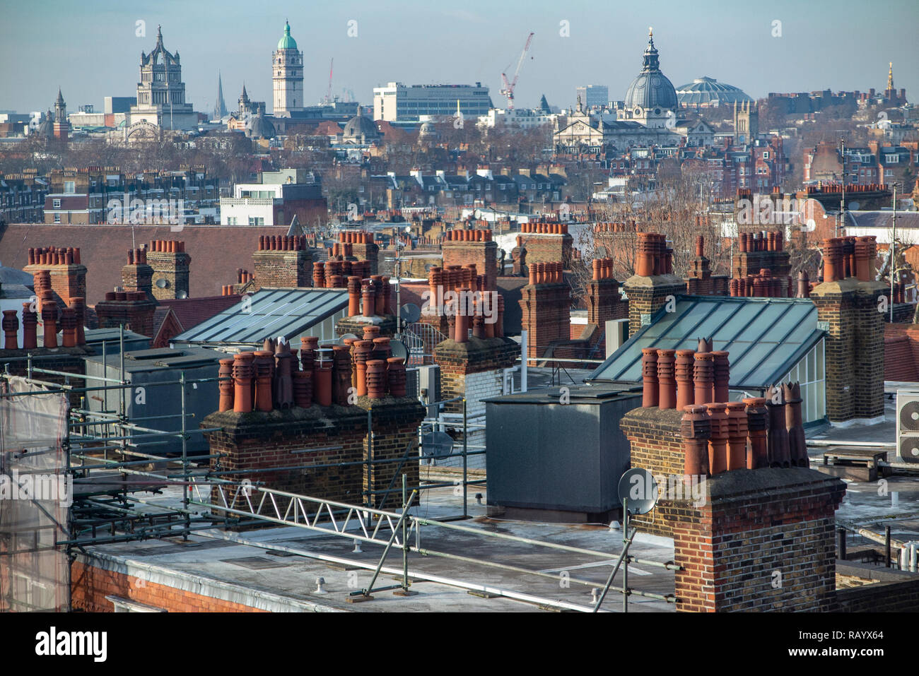 The London skyline, Chelsea chimneys and roof tops in the foreground ...