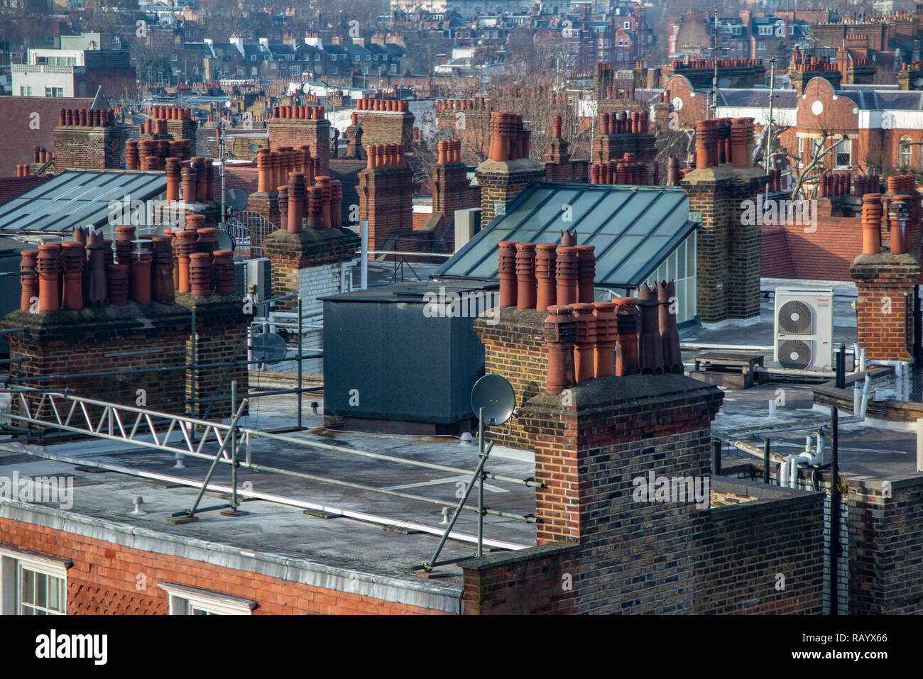 The London skyline, Chelsea chimneys and roof tops in the foreground ...