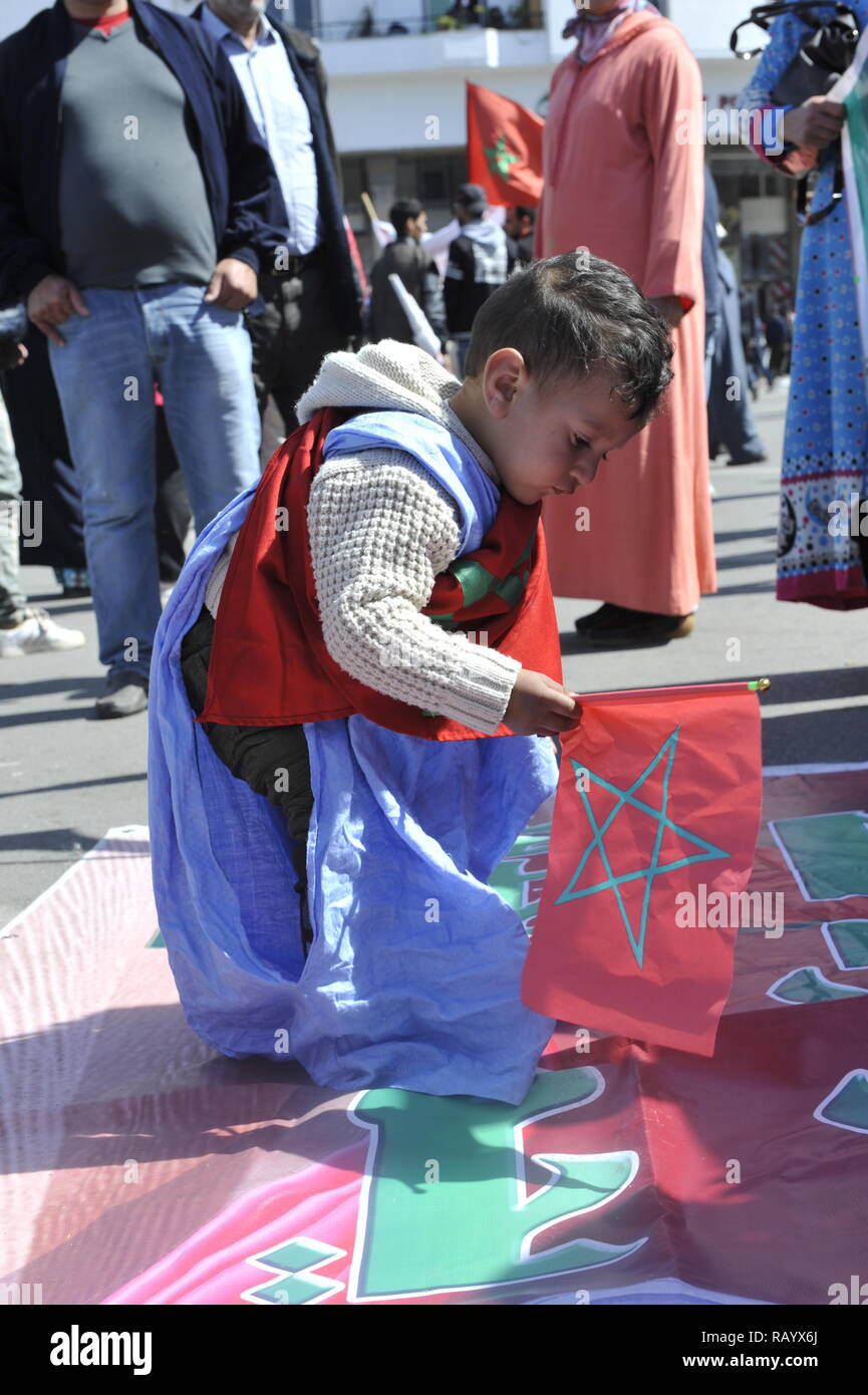Moroccan child proudly carrying Moroccan flag - child from Moroccan ...