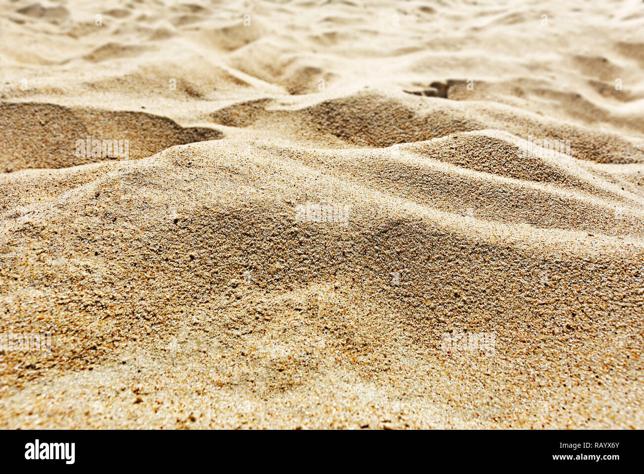 Sand dunes in the desert or on the beach in close-up in the deep sun ...