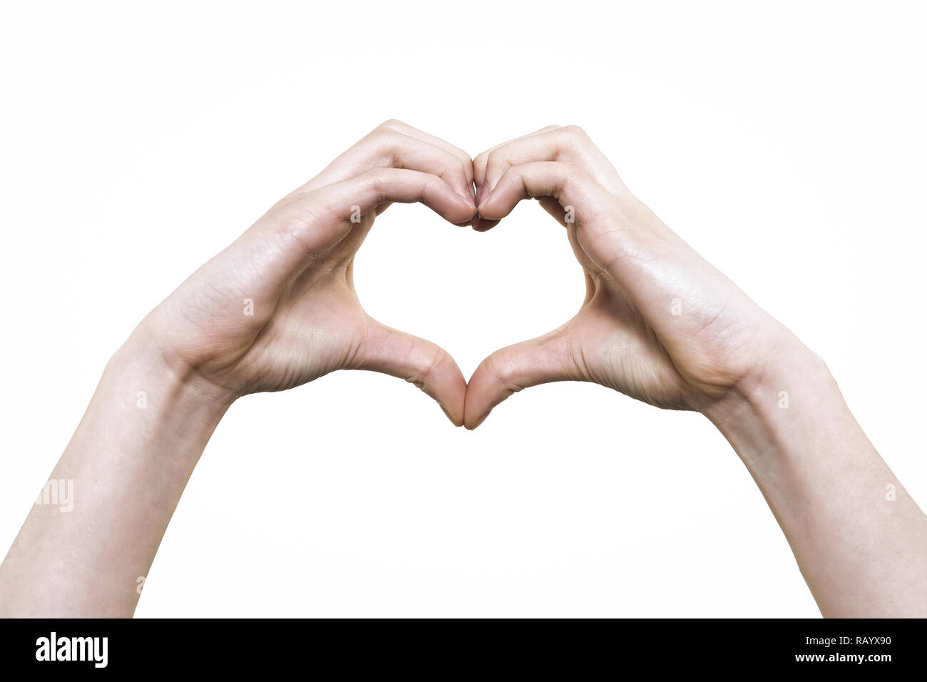Woman hands make heart sign on the white background Stock Photo - Alamy