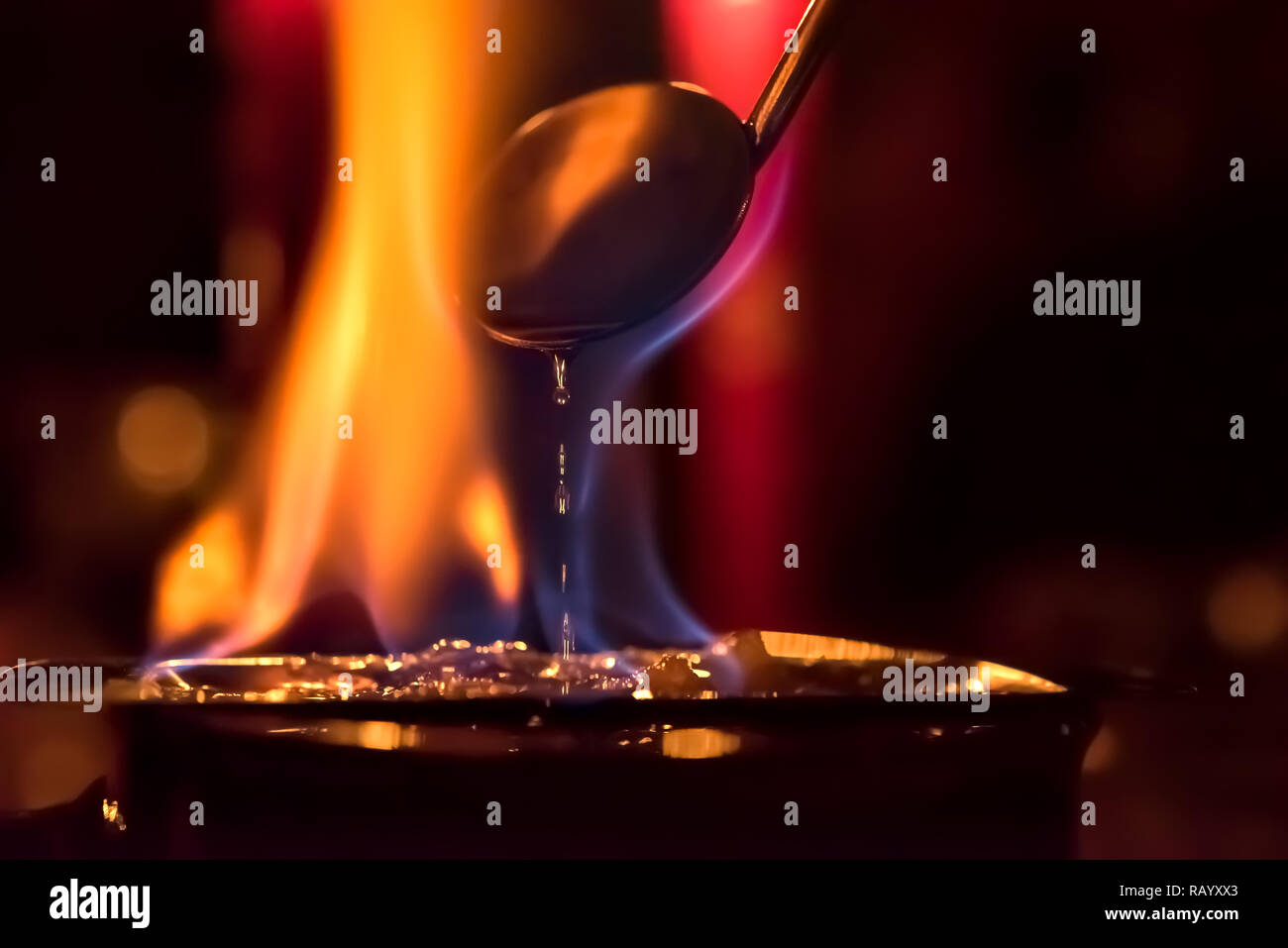 burnt punch: blue flame with colored fire background Stock Photo - Alamy
