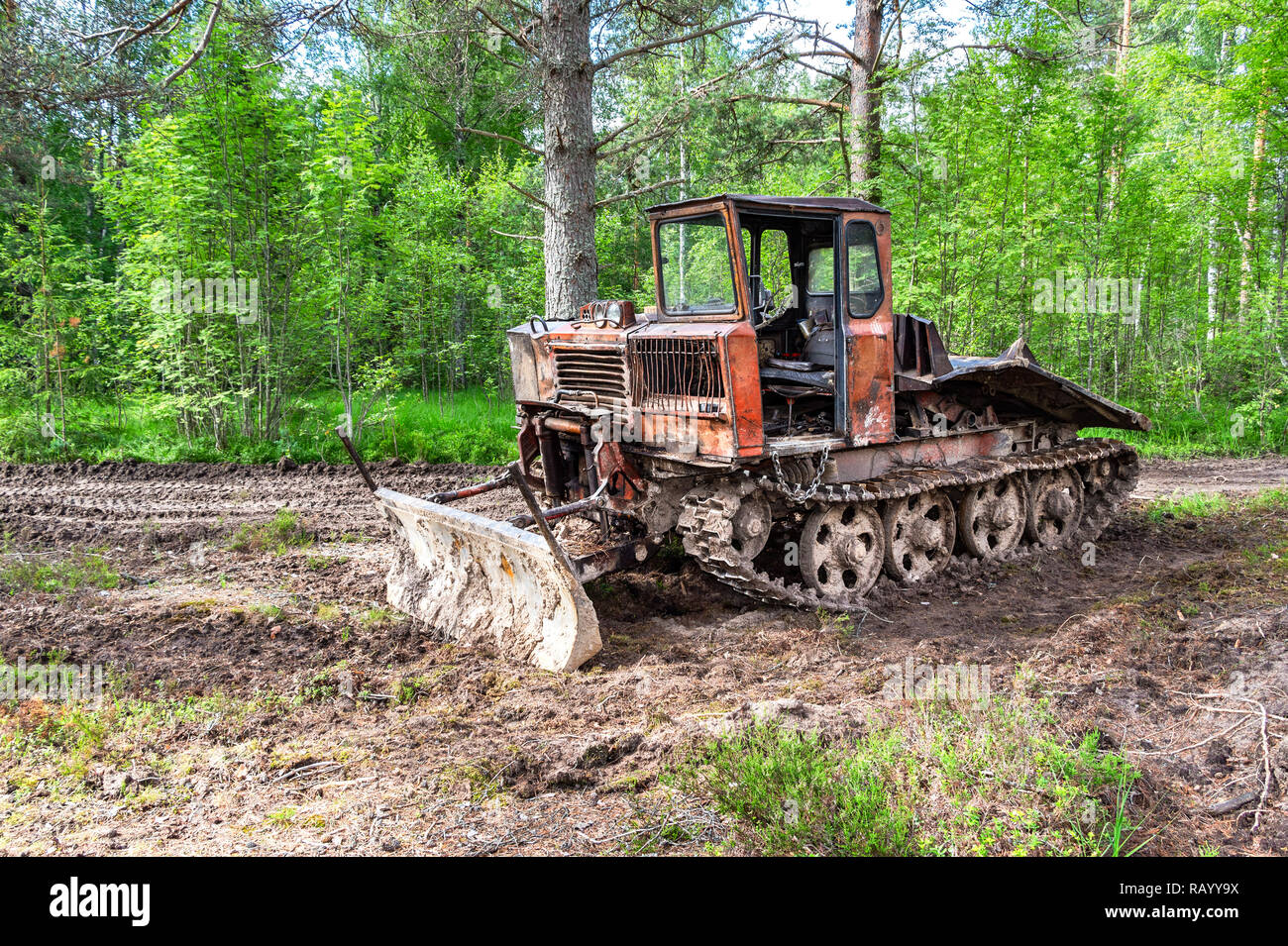 Old skidder at the forest in summertime. Skidding machine for timber ...