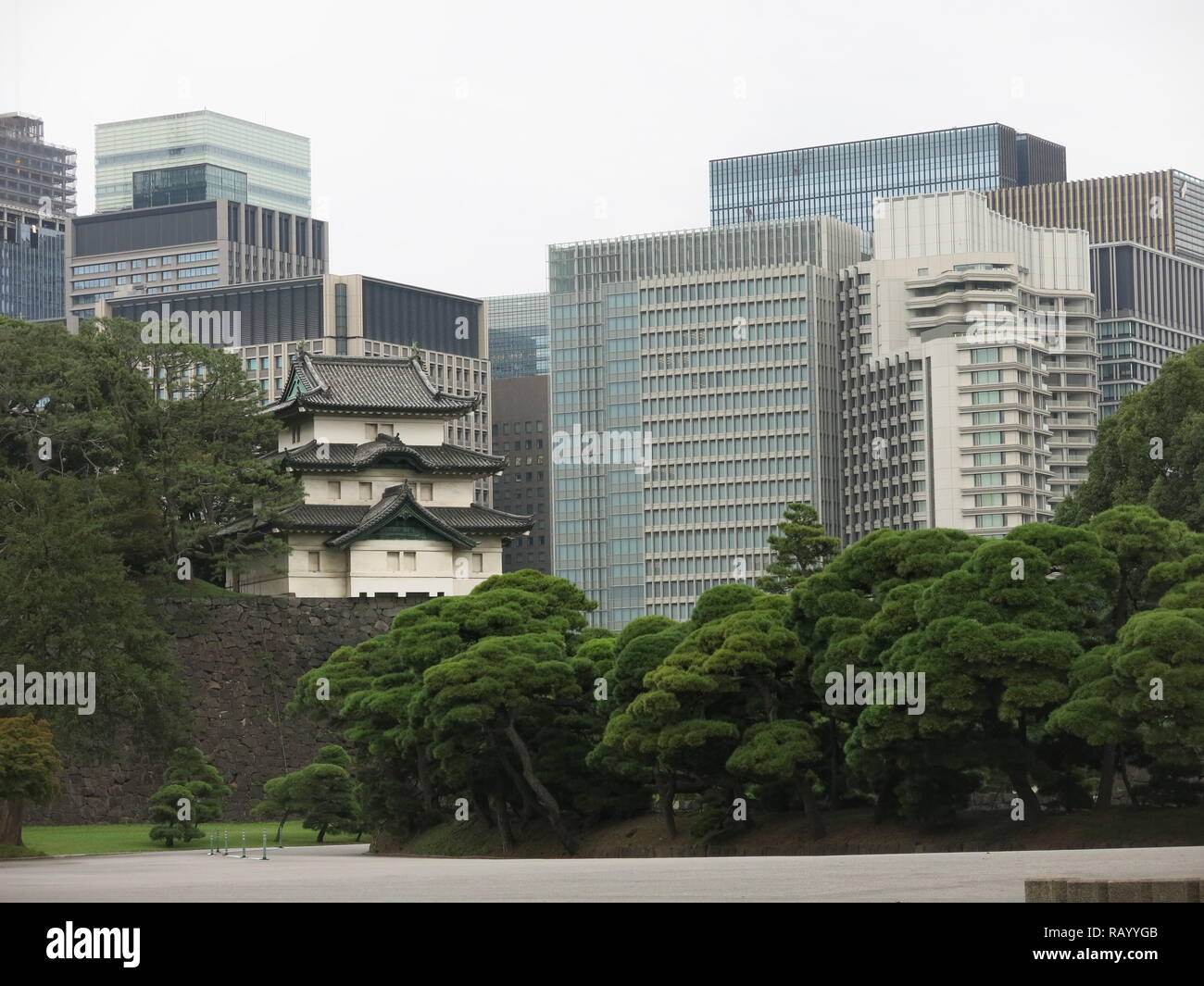 Dwarfed by modern office blocks, one of the old guard towers atop the ...
