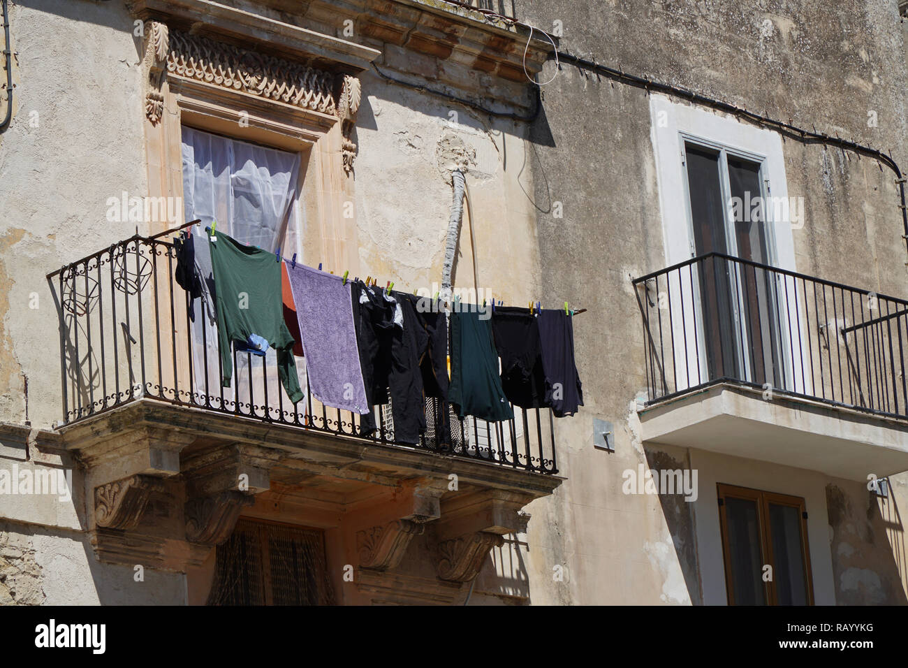 Washing drying on a balcony in Sicily, Italy Stock Photo - Alamy