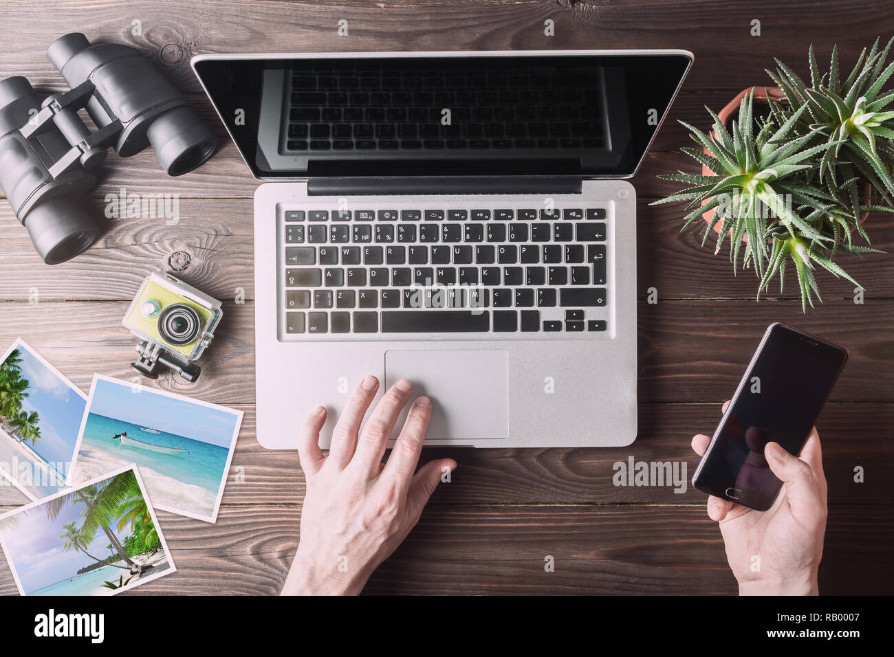 Planning a vacation on computer Stock Photo - Alamy