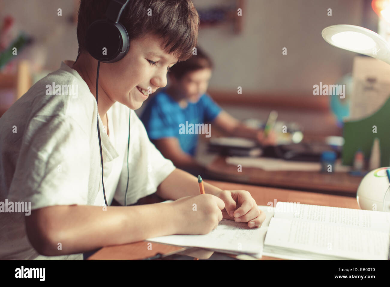 Young boys doing homework or learning at home Stock Photo - Alamy