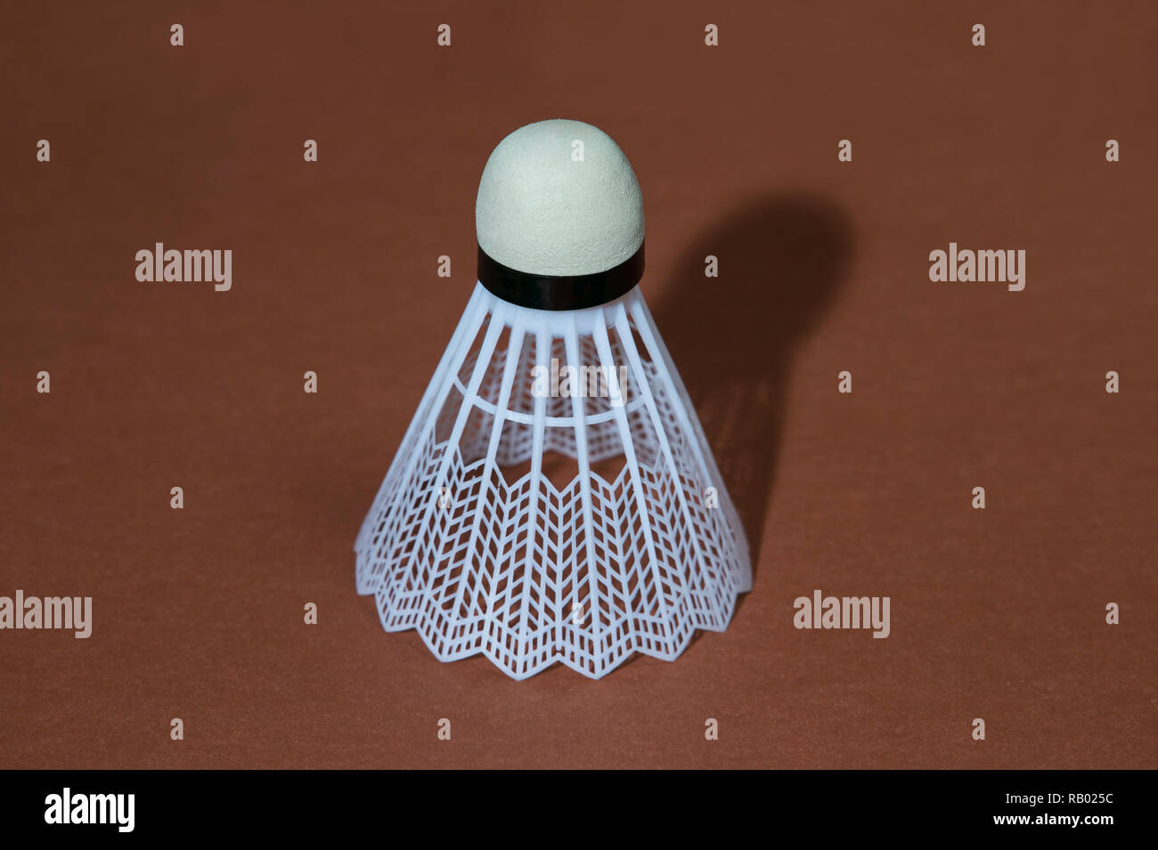 Badminton shuttlecock isolated on the brown background Stock Photo - Alamy