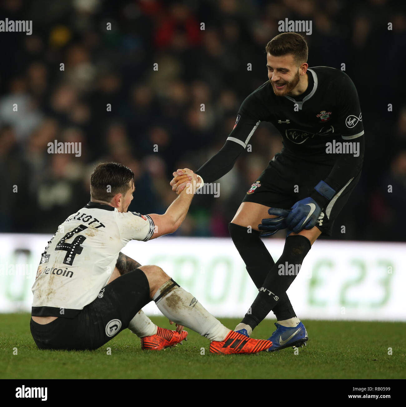 Angus gunn helps jack marriott up after his miss hi-res stock ...