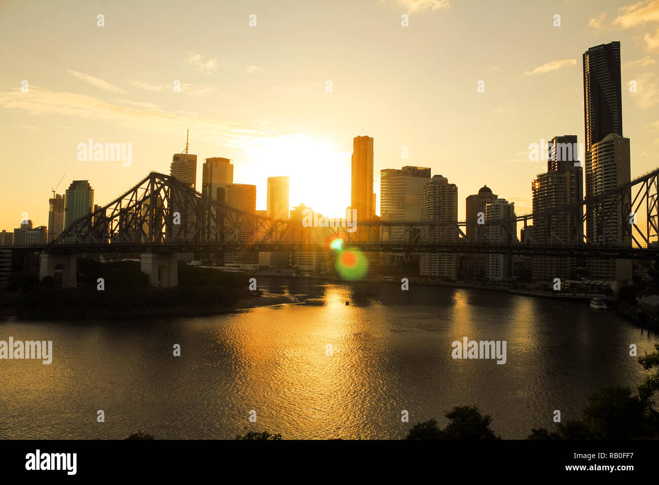 Skyline of Brisbane with Story Bridge during sunset in the background ...