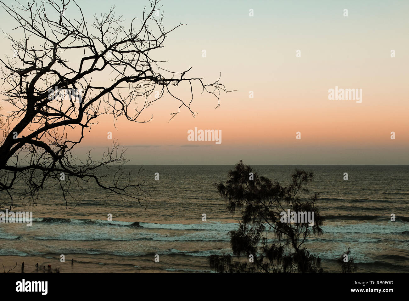 View of a typical Australian beach - Coolum Beach - during sunset with ...