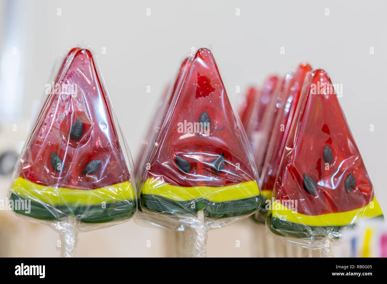 sweet slice, watermelon lollipop on a long stick in the form of a ...