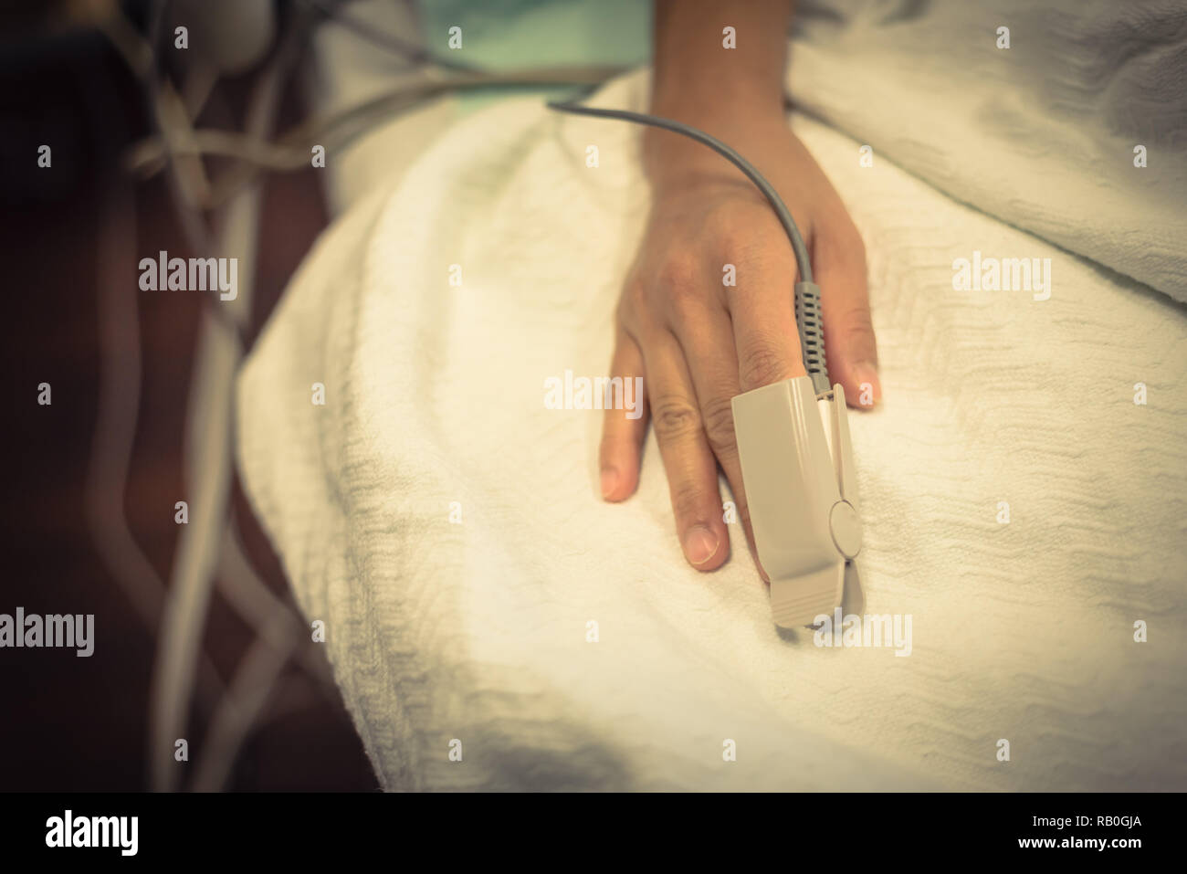 Woman hand with pulse oximeter and heart rate fingertip equipmen Stock ...