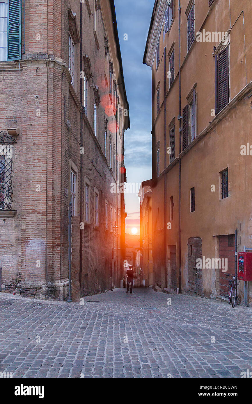 A sunset in the old town of Jesi (Italy) , where there are a lot of ...