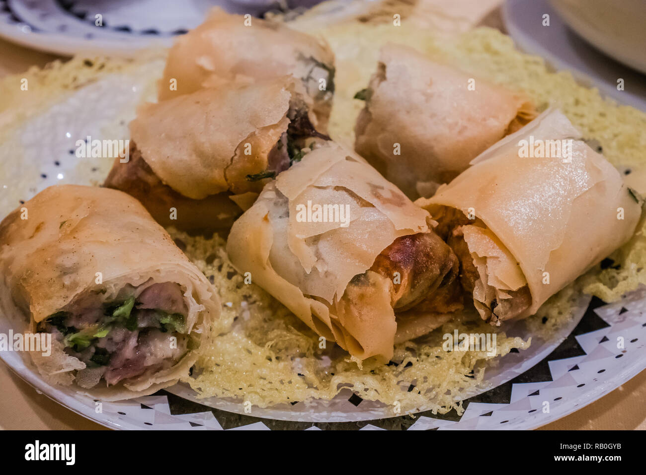 crispy spring roll dim sum cut into halves Stock Photo - Alamy