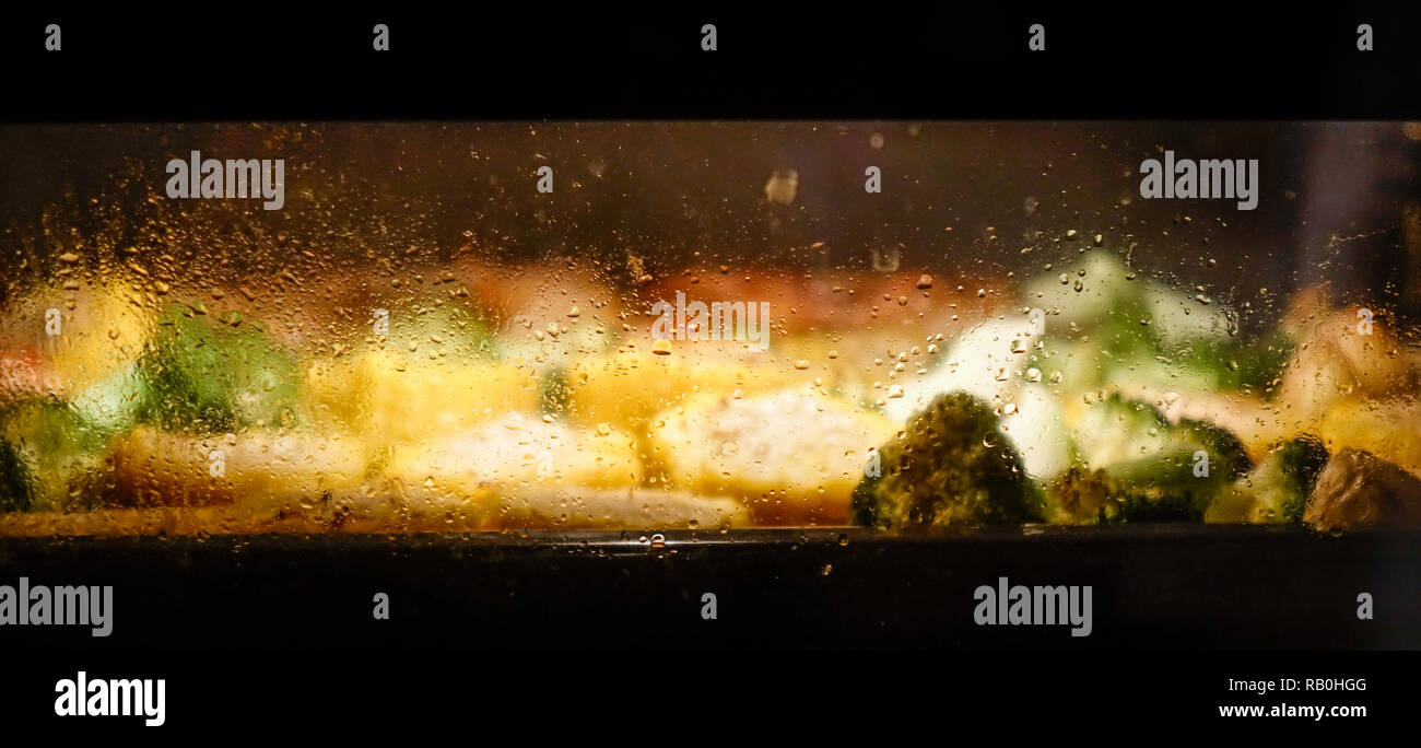 Foods in glass oven, cooking background. Meat and vegetable Stock Photo ...