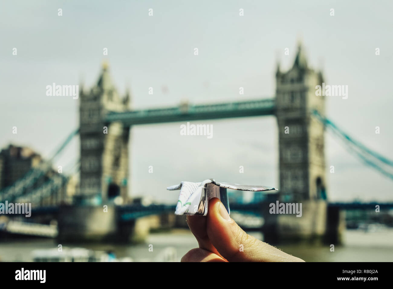 Paper plane out of newspaper in front of Tower Bridge in London (London ...