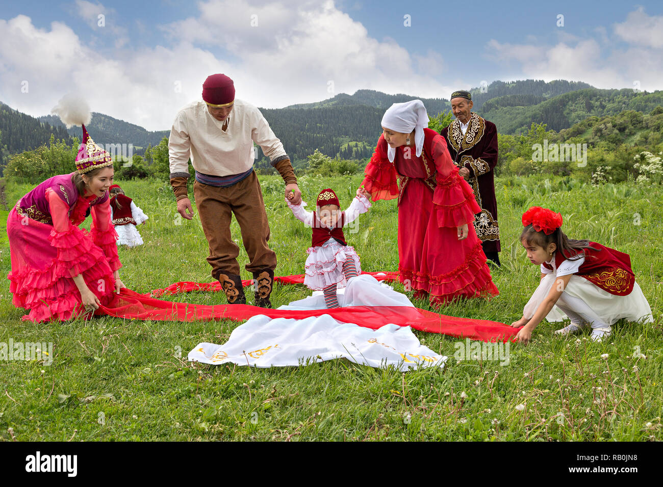 Kazakh people showing local tradition of Tusau Kesu which symbolizes a ...