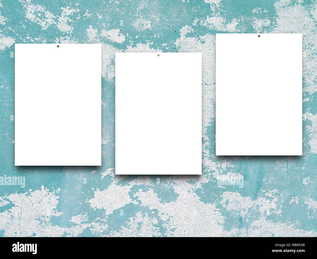 Three blank frames on aqua and white scratched concrete wall background ...