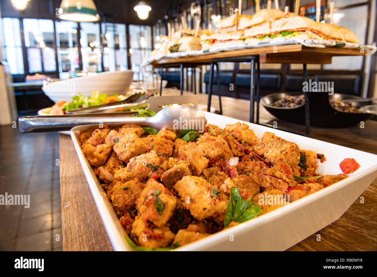 Serving tray on buffet meal table in restaurant, interiors wide shot no ...