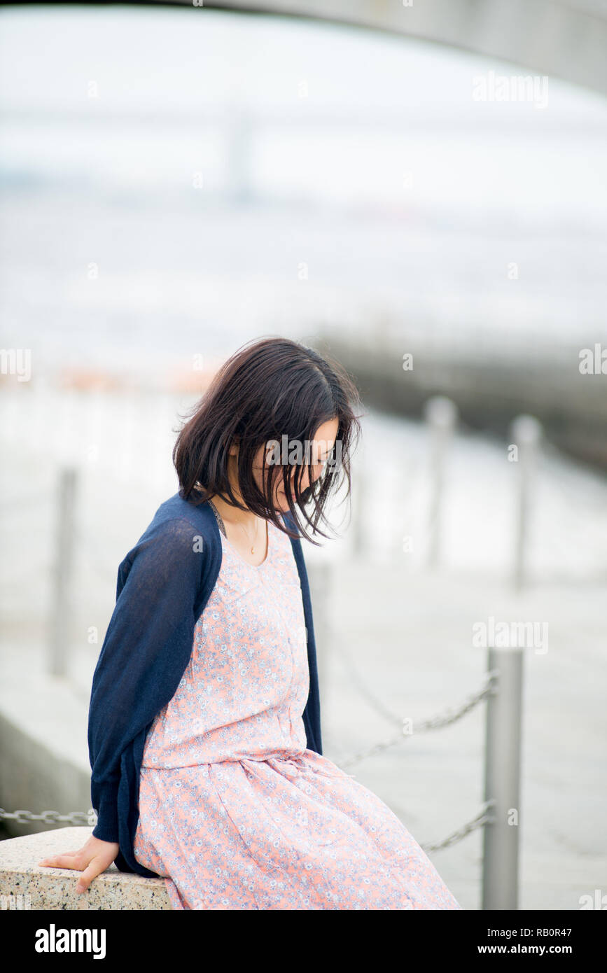 Asian female model poses for pictures on the street Stock Photo - Alamy