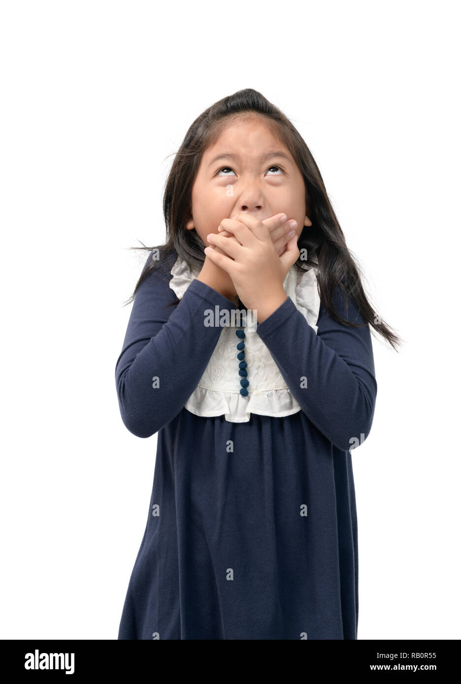 Shocked kid covering her mouth with hands isolated on white bcakground ...