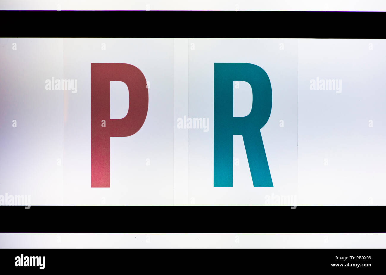 PR letters on backlight board. Colored Characters P and R on white ...