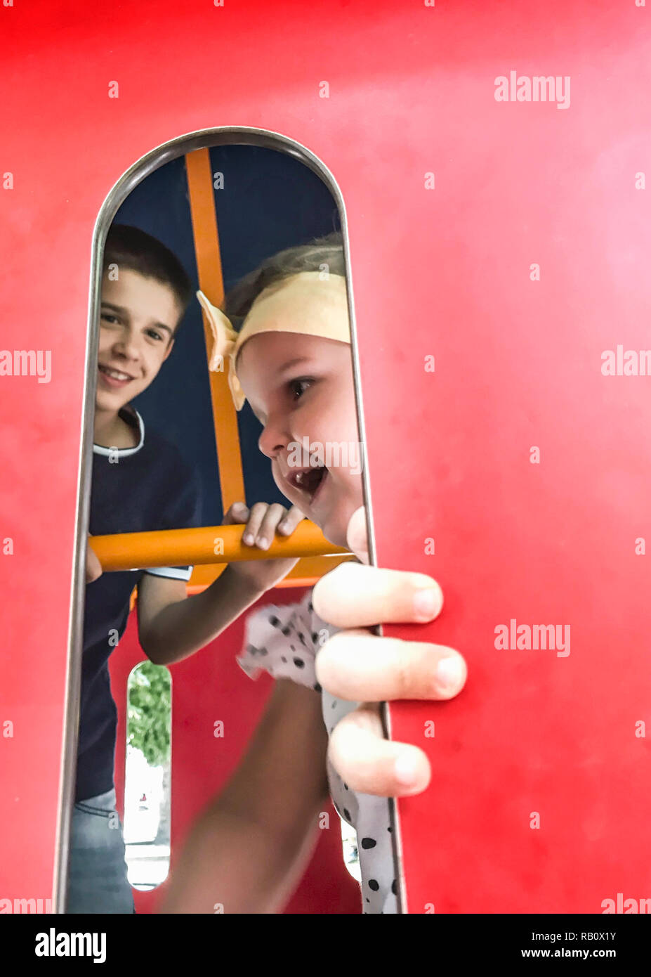 Children playing playground faces hi-res stock photography and images ...