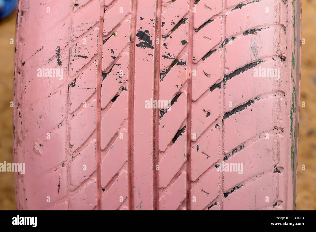 The used car tires, painted pink color Stock Photo - Alamy