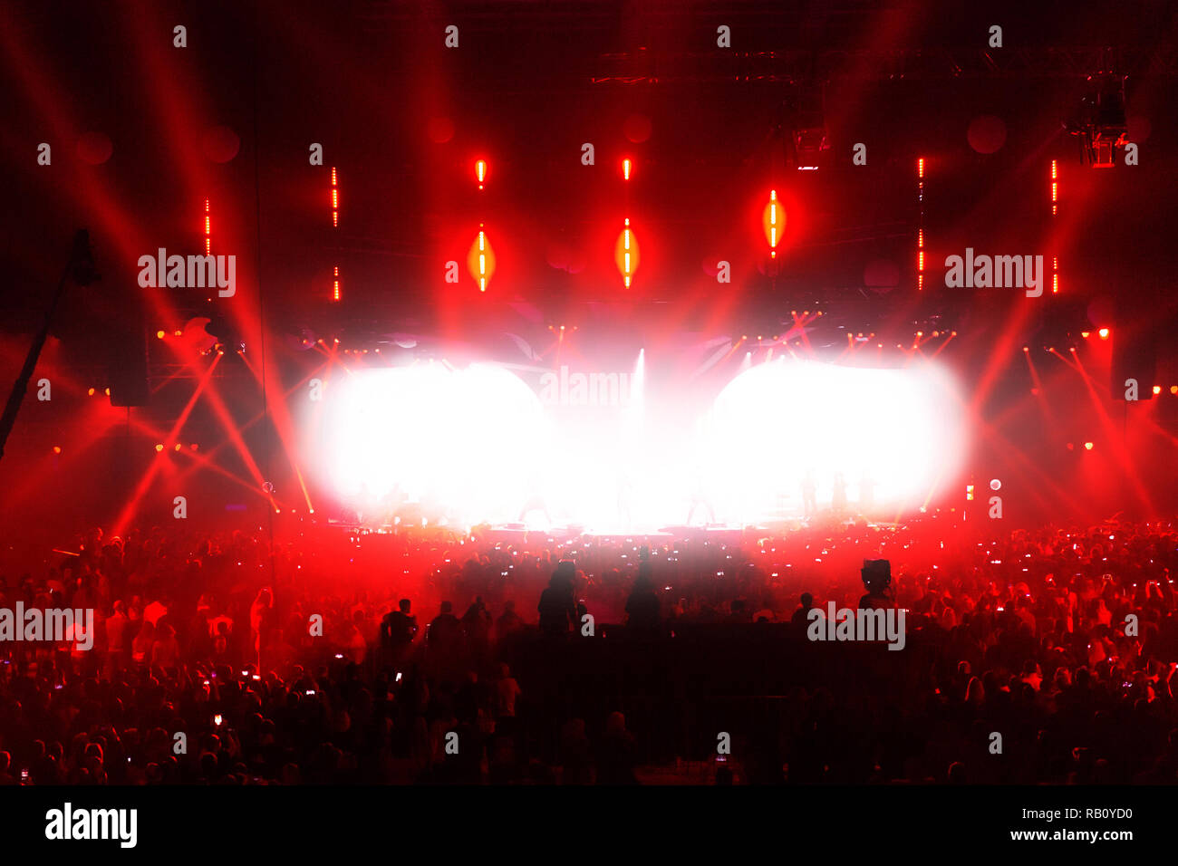 Concert crowd having fun at a rock concert. Large concert hall with a ...